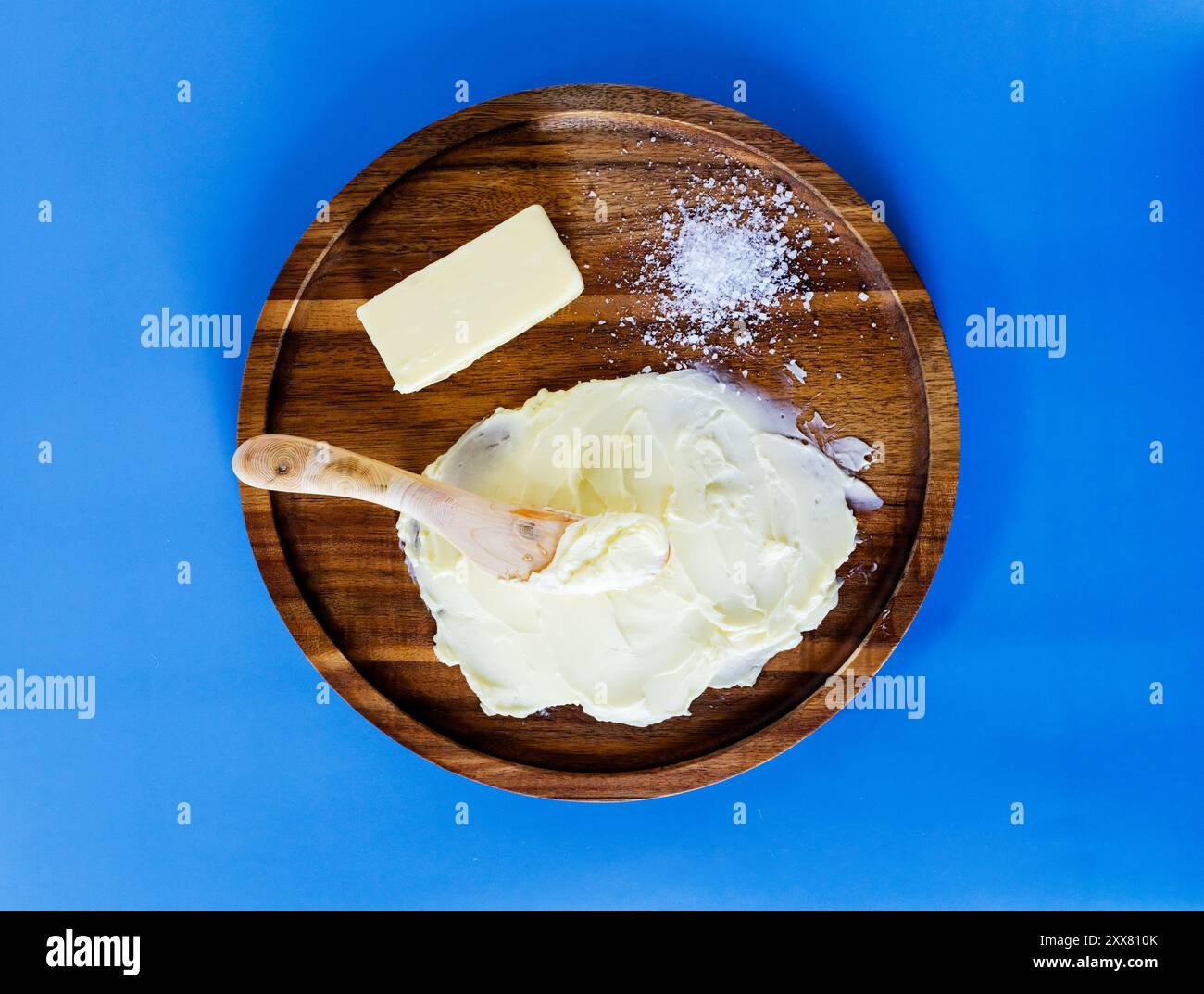 Overhead View of Creamy Butter and Salt on Wood Dish Stock Photo - Alamy