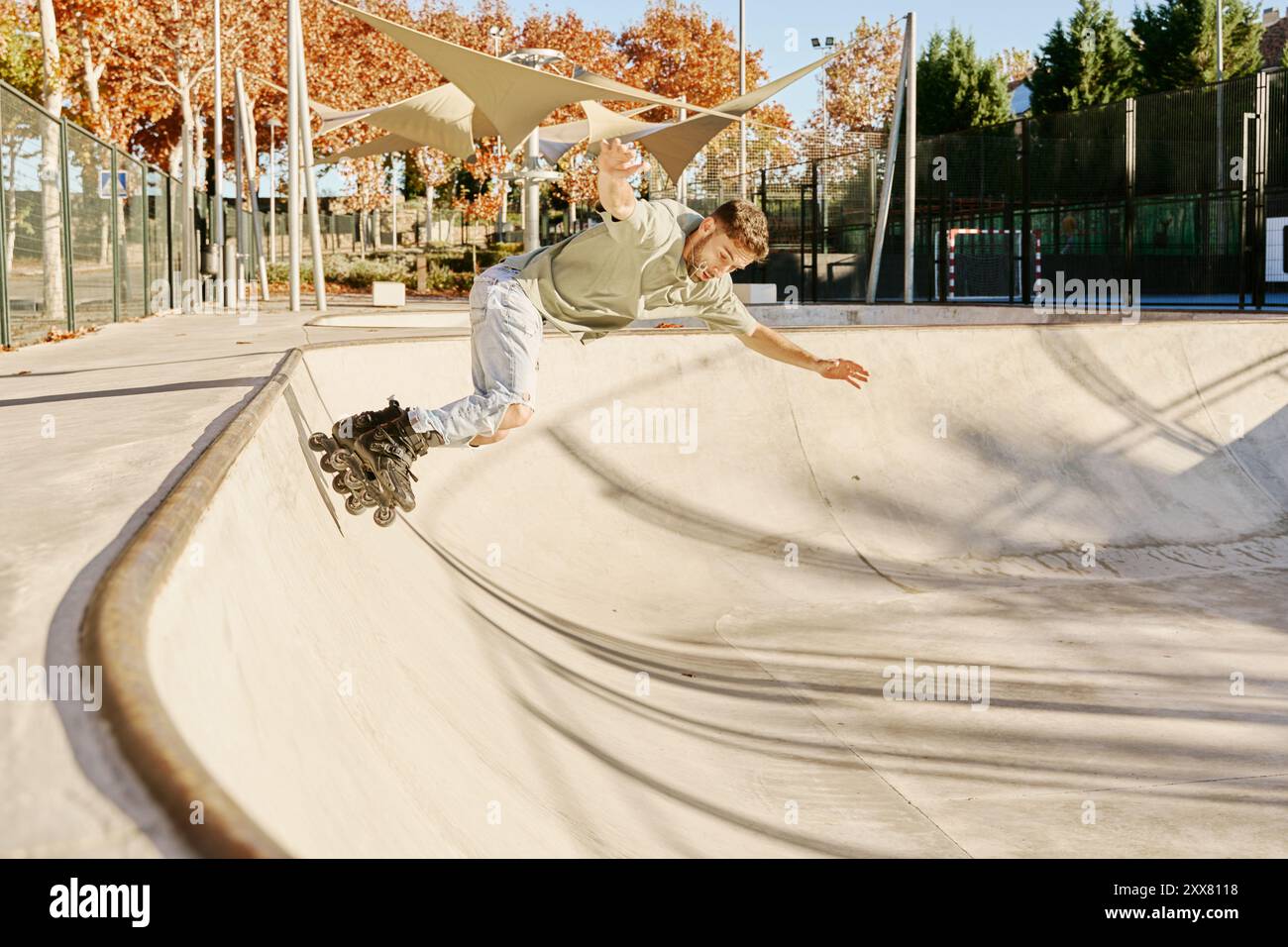 Male roller skater practising on a ramp Stock Photo - Alamy