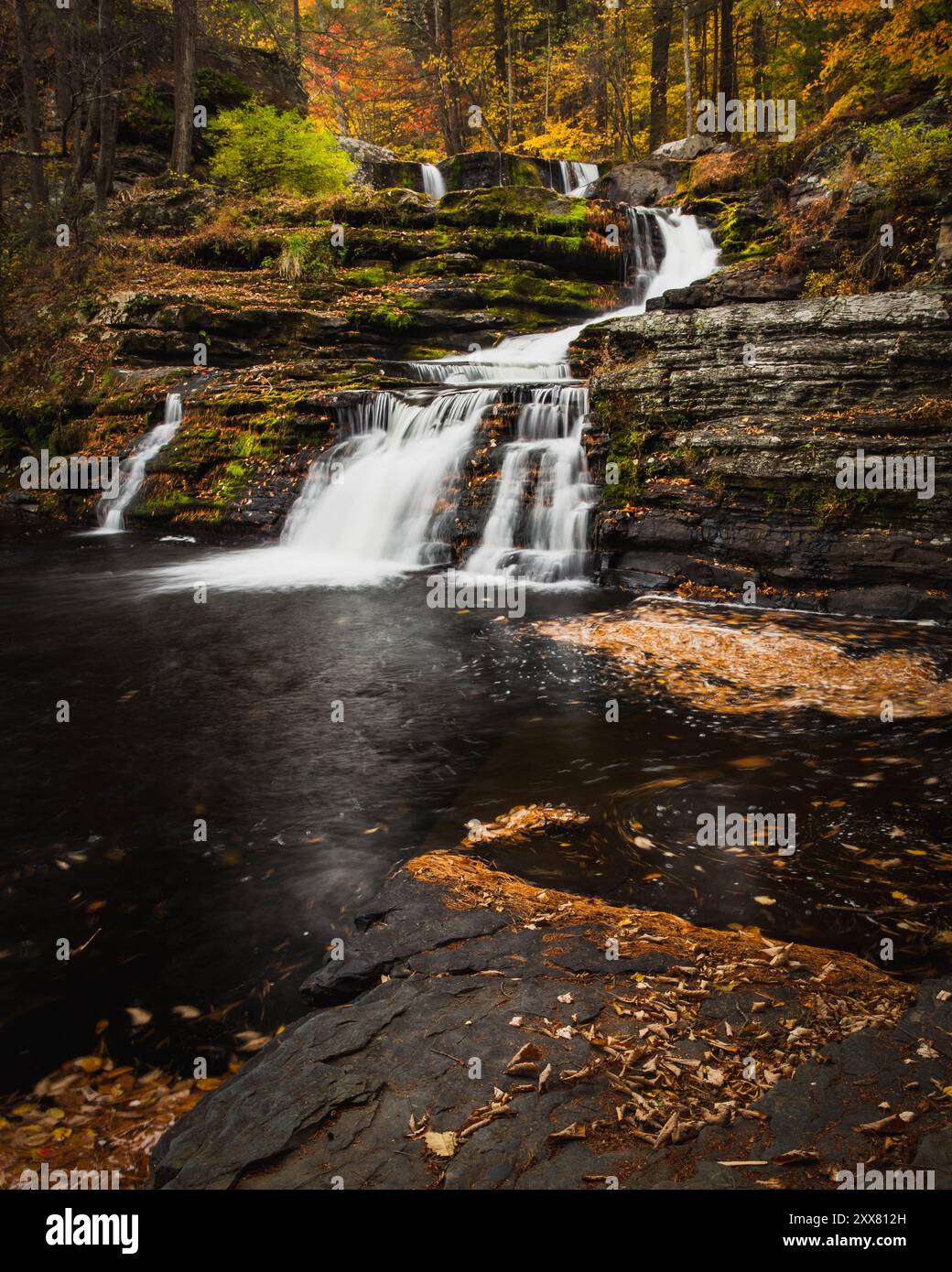 Pennsylvania waterfall in autumn with leaves swirling below Stock Photo ...