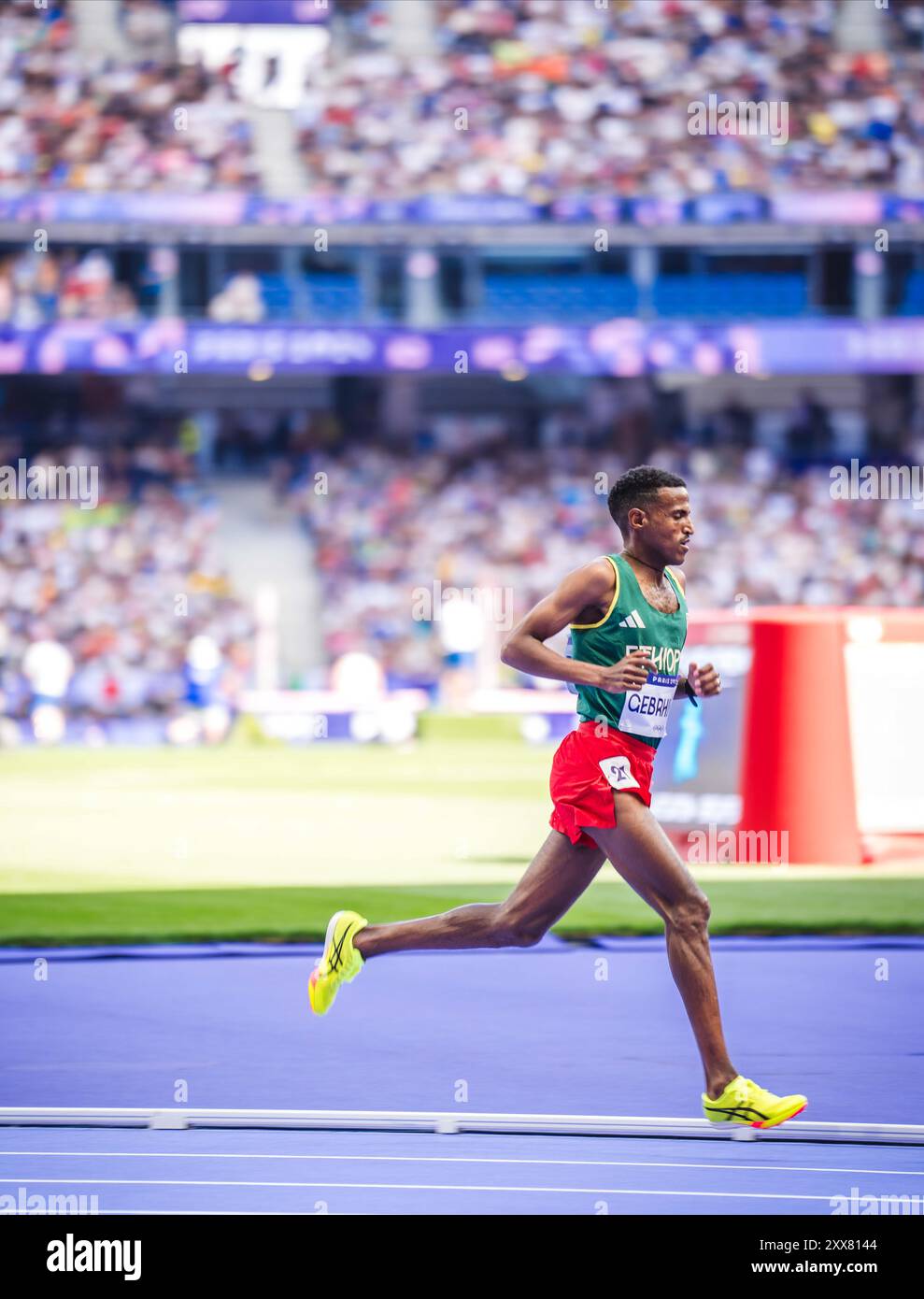 Hagos Gebrhiwet participating in the 5000 meters at the Paris 2024 ...