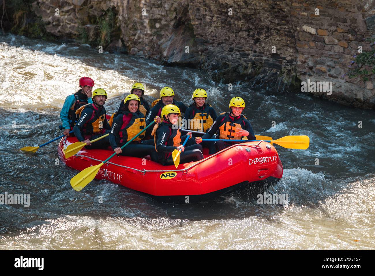 Kayaking through thrilling river rapids Stock Photo - Alamy