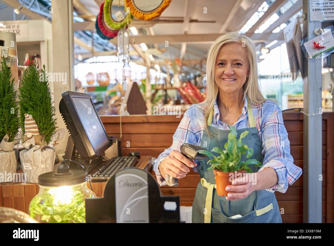 woman cashier scanning a bar code Stock Photo - Alamy
