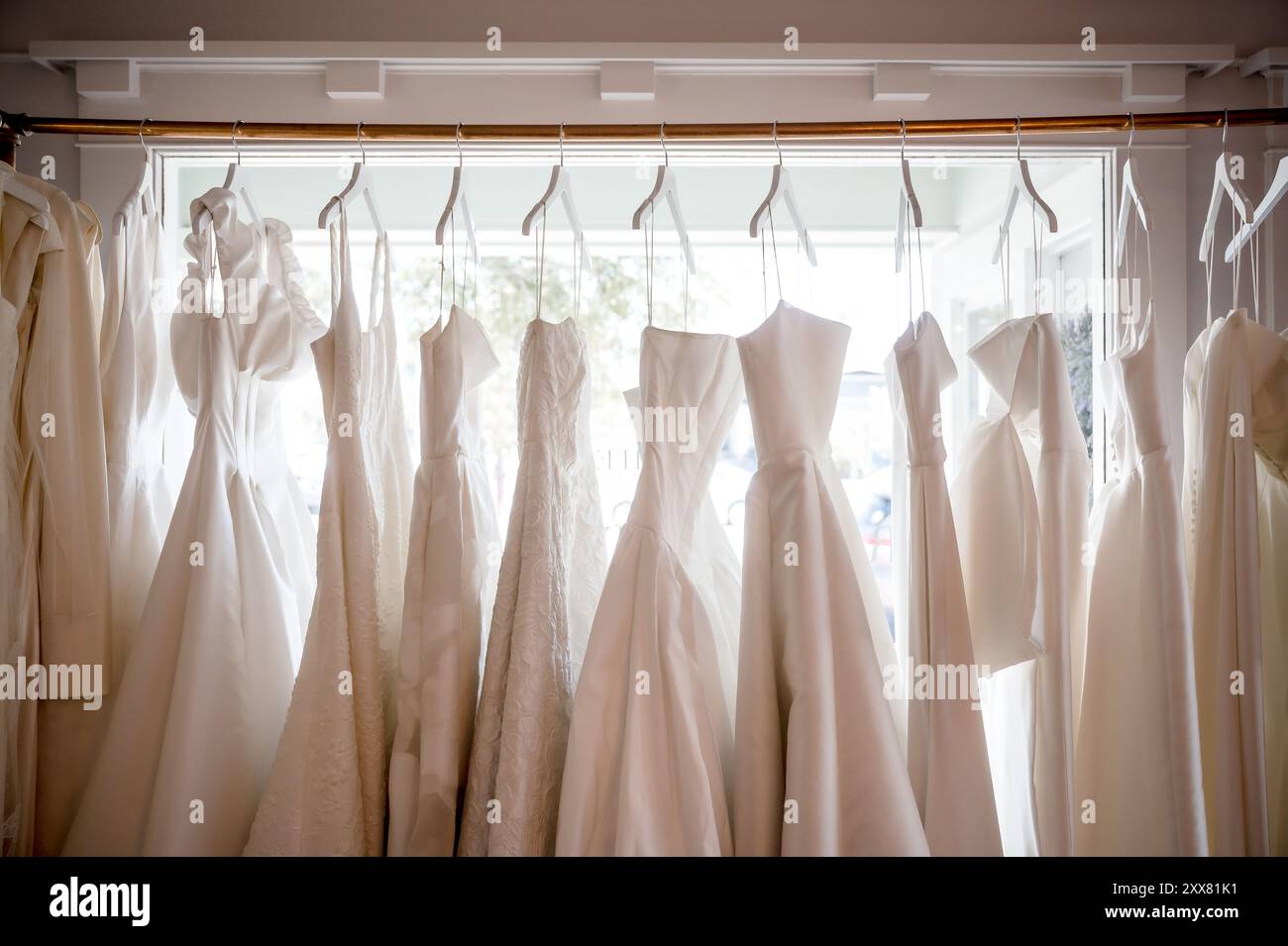 Rack of bridal gowns hi-res stock photography and images - Alamy