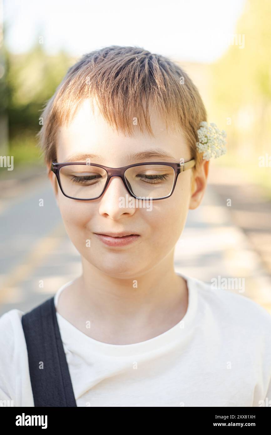 Nice boy with flowers in the hands Stock Photo - Alamy