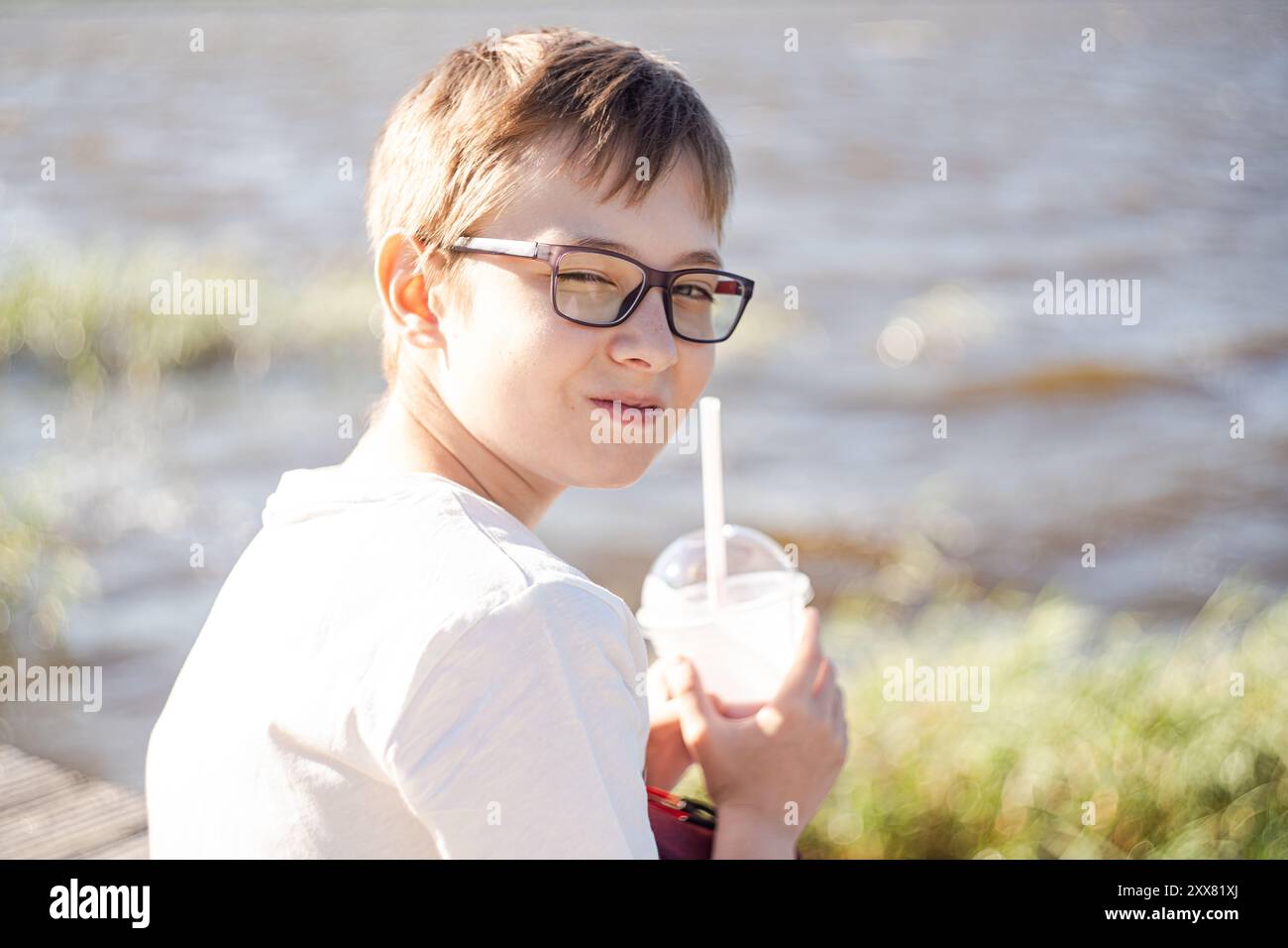 Nice boy drinking milk shake Stock Photo - Alamy
