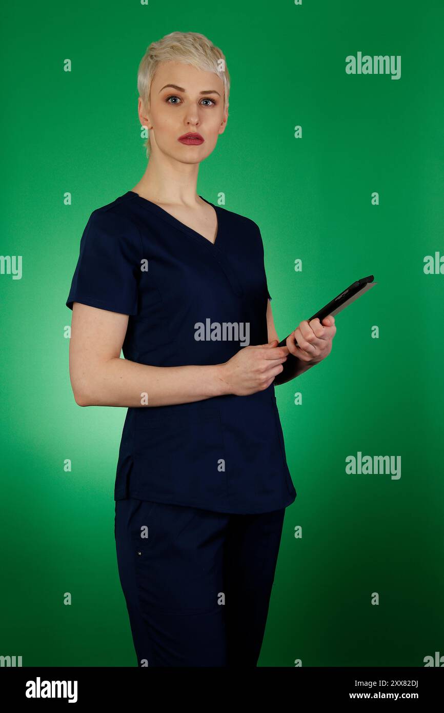 Medical technician in scrubs on green screen Stock Photo - Alamy