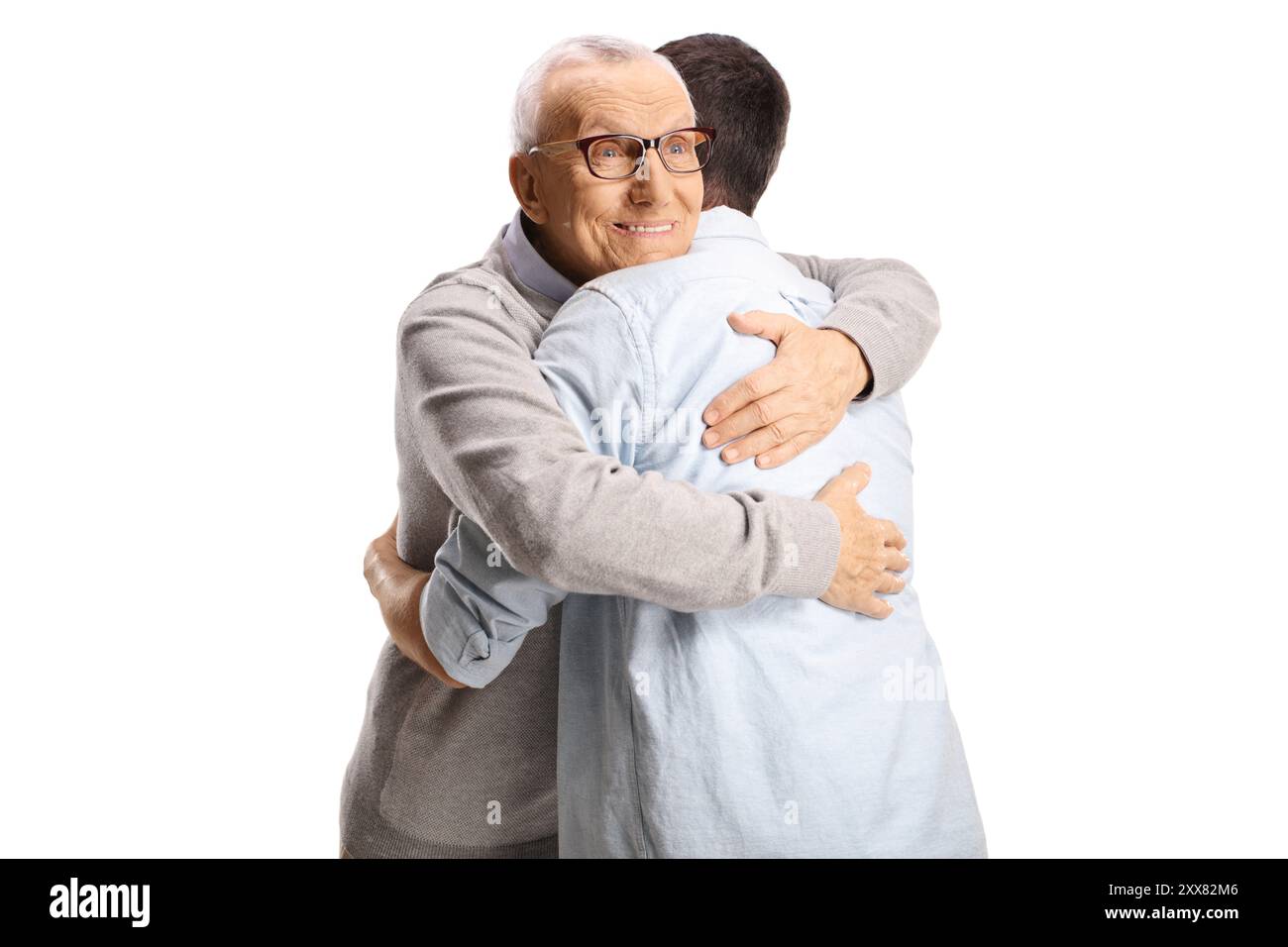 Elderly man hugging a younger man isolated on white background Stock ...