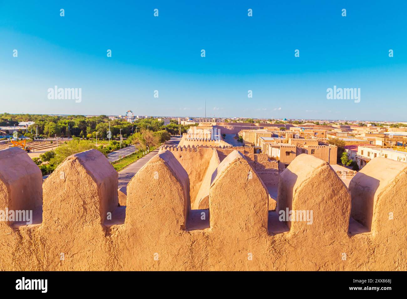 The city walls of the ancient city of Khiva at sunset. Khiva ...