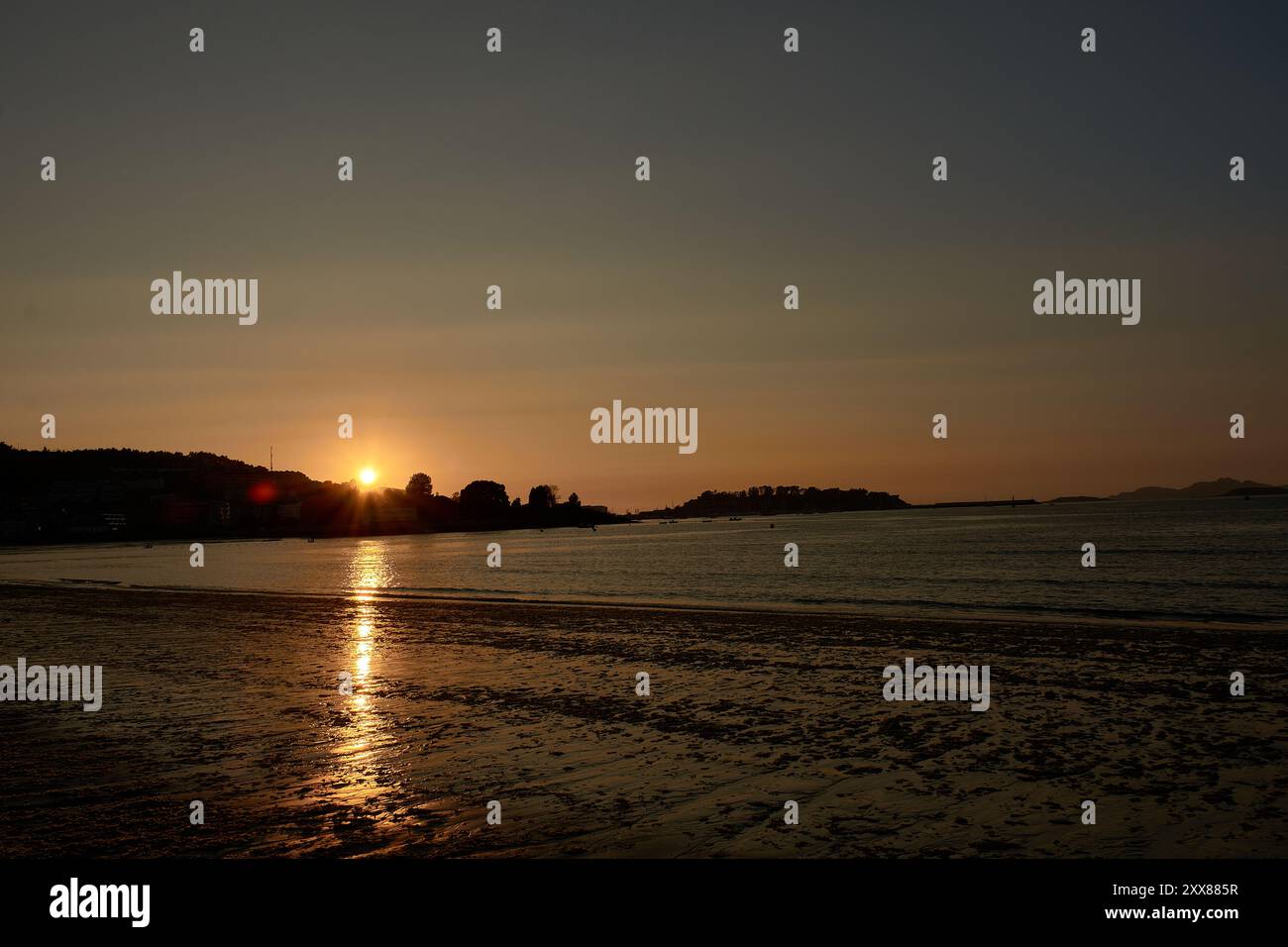 Extraordinary sunset at Ladeira Beach in Bayona, where vibrant orange ...