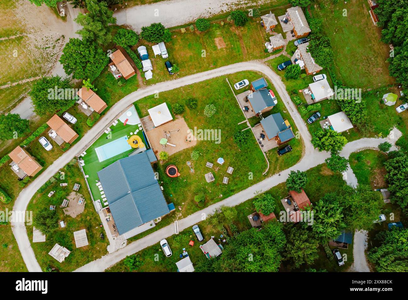 Top down view of camping with cabins, bungalows, caravans, swimming ...