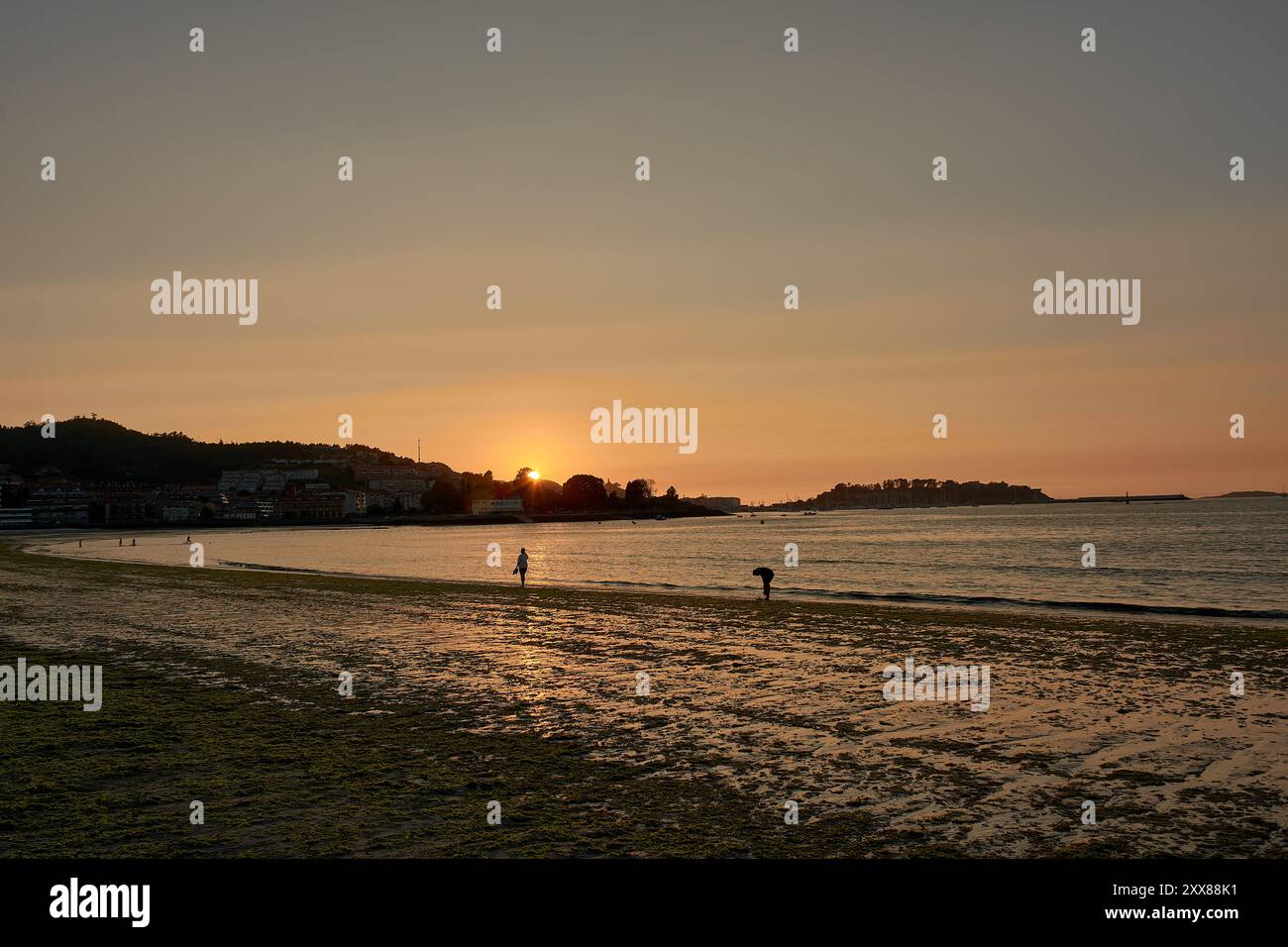 Extraordinary sunset at Ladeira Beach in Bayona, where vibrant orange ...