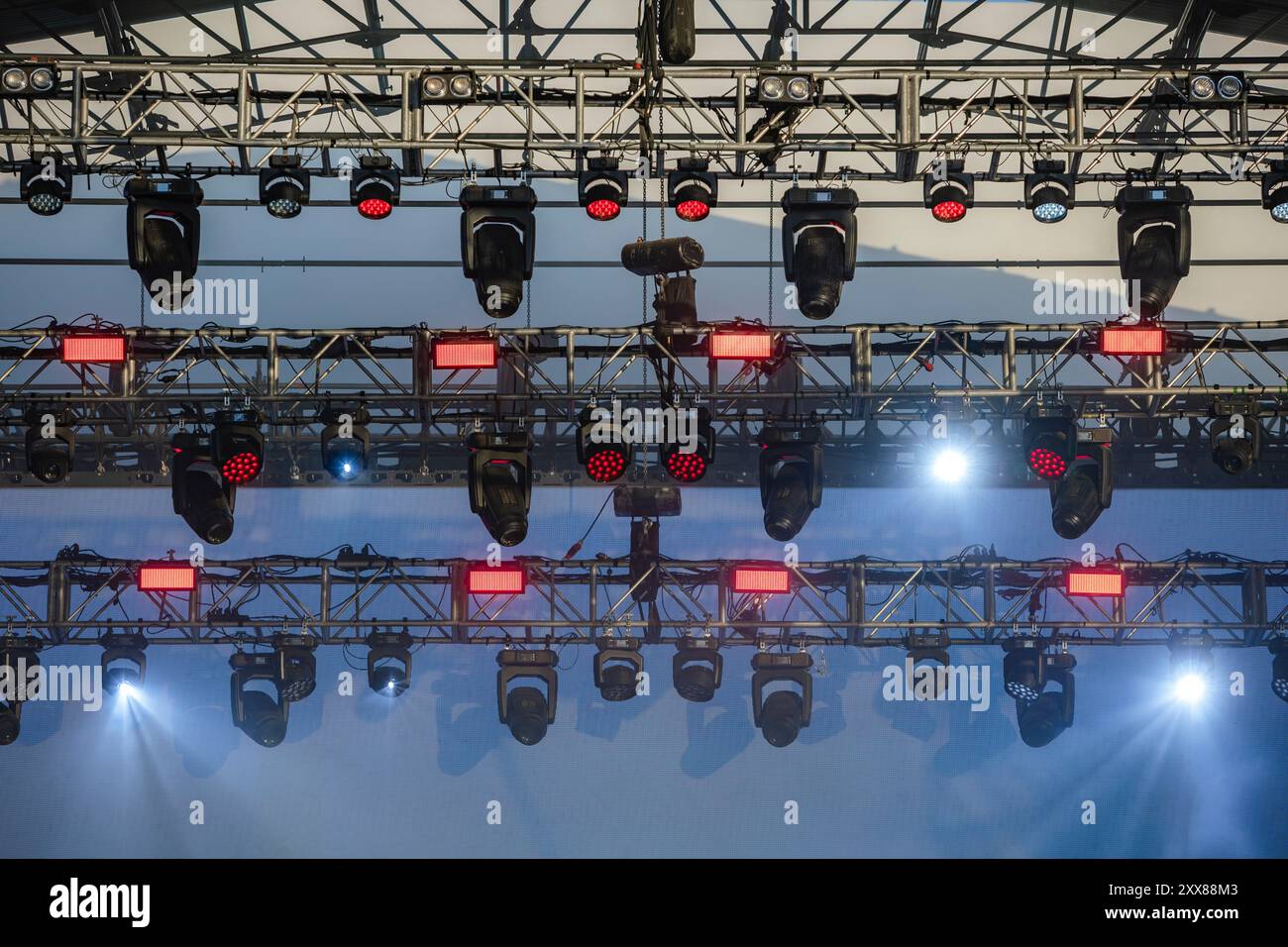 Design of spotlights hanging on the ceiling of the stage at a music ...