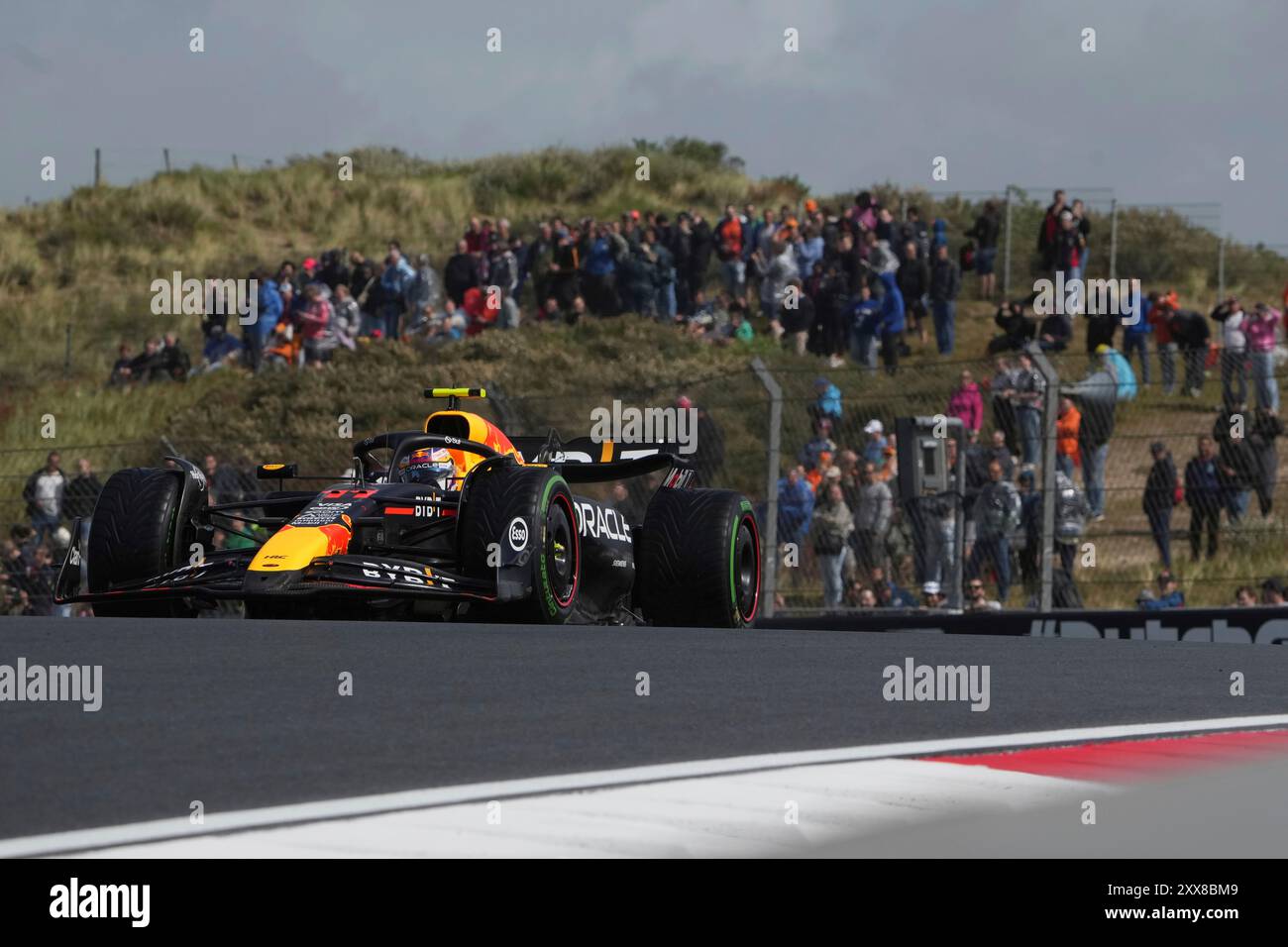 Red Bull driver Sergio Perez of Mexico steers his car during the first practice session ahead of ...