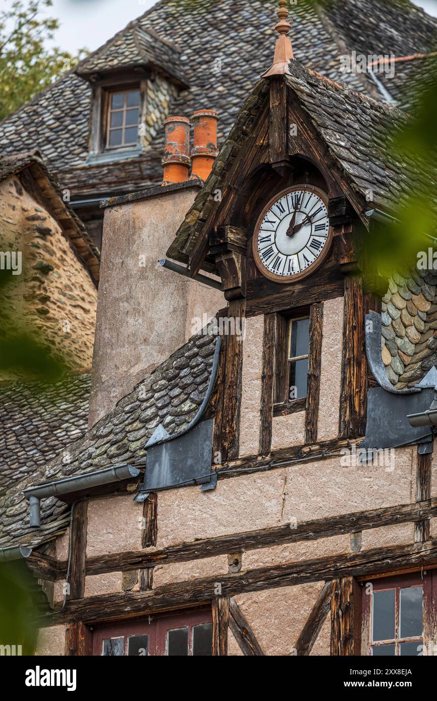 France, Aveyron, Conques, labelled Plus Beaux Villages de France, clock ...