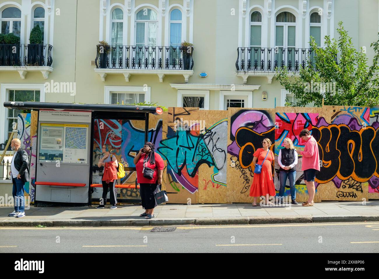 London, UK. Hoarding being put up to protect multimillion pound houses ...