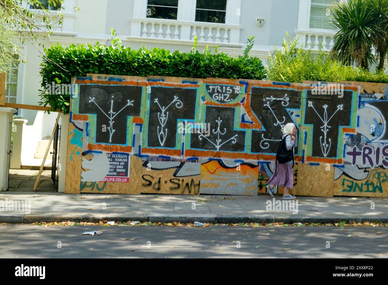 London, UK. Hoarding being put up to protect multimillion pound houses ...