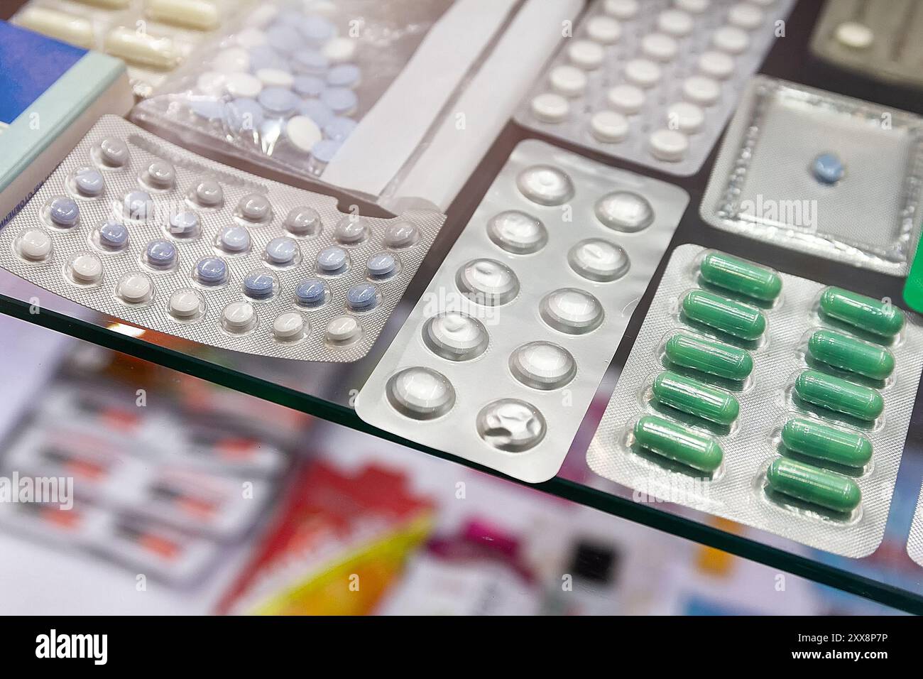 A variety of unbranded tablets on the pharmacy counter. Pharmacology ...