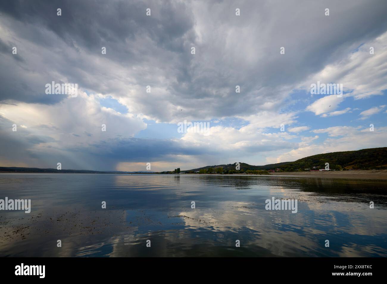 landscape with rain clouds above a lake Stock Photo - Alamy