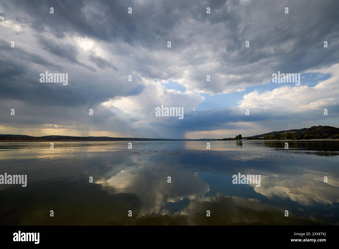 landscape with rain clouds above a lake Stock Photo - Alamy