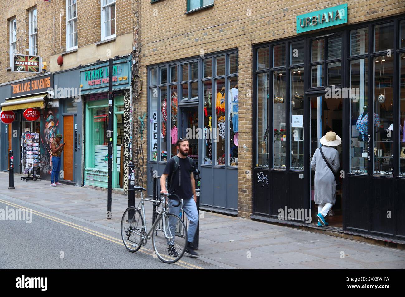 LONDON, UK - JULY 13, 2019: People visit Brick Lane street in ...