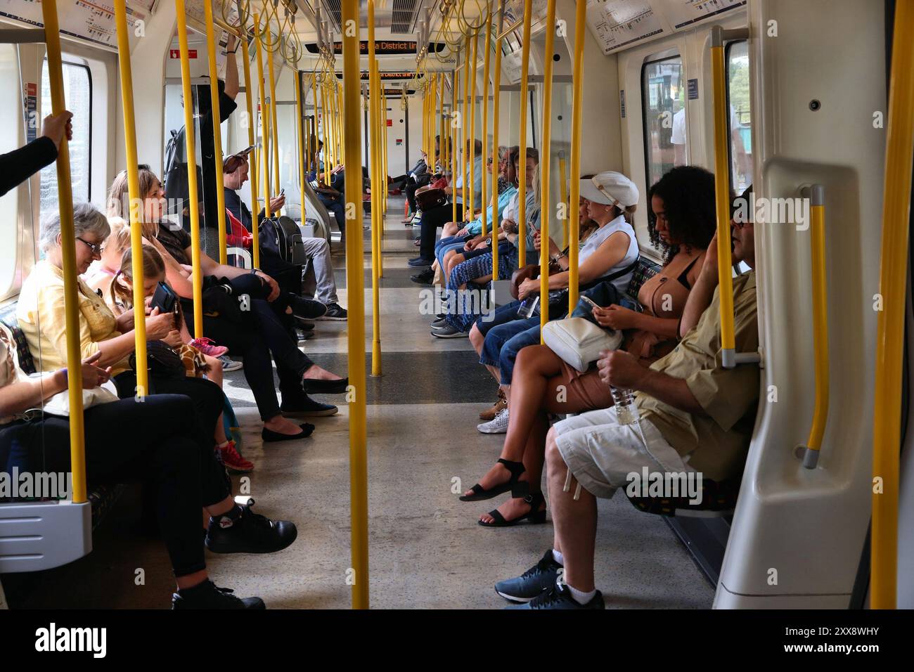LONDON, UK - JULY 13, 2019: Passengers ride London Underground train on ...