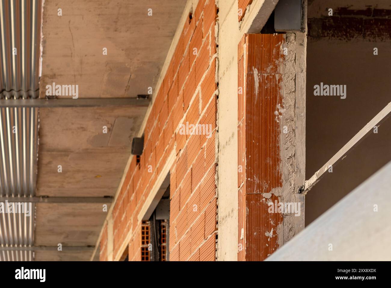 Angled view inside a construction site showing exposed brickwork ...