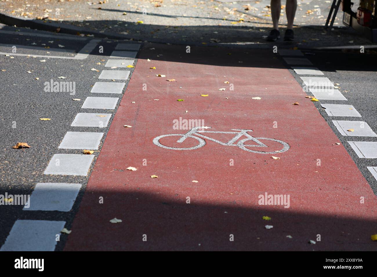 Bicycle path in Germany. Cycle path road crossing marking in ...