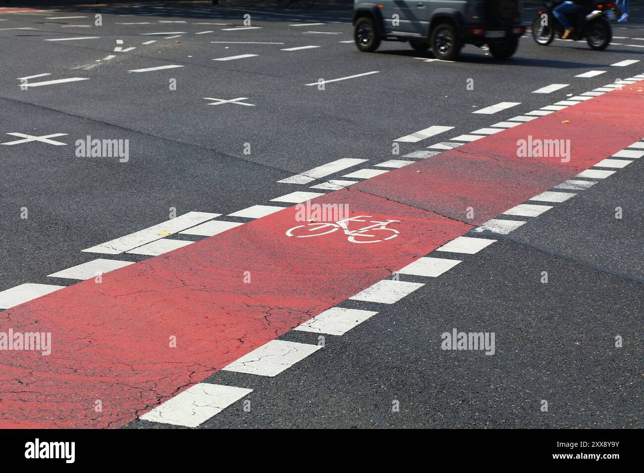 Bicycle path in Germany. Cycle lane marking on city road in ...