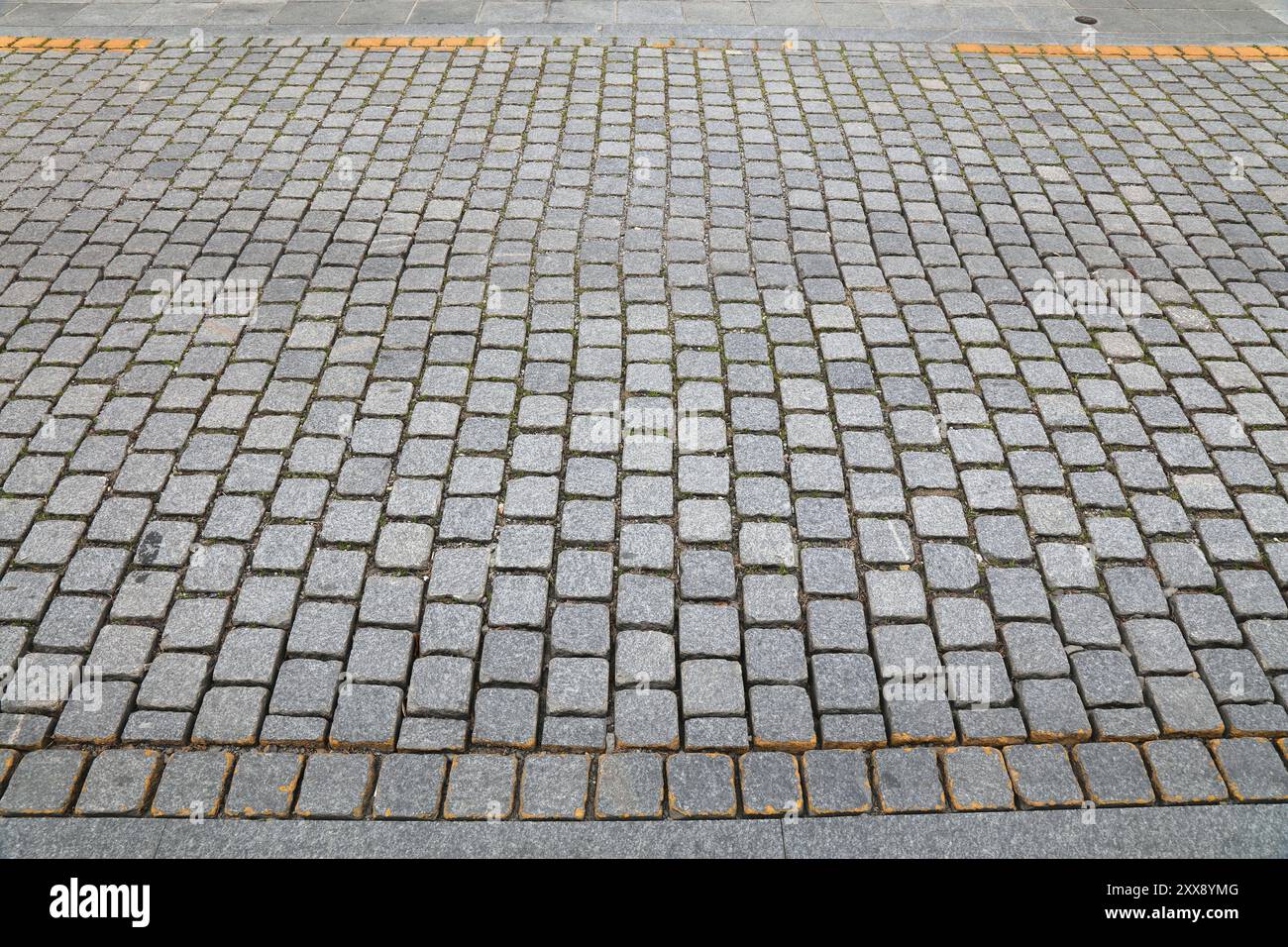 Stone paved street. Modern stone pavement. New granite cobblestone in ...