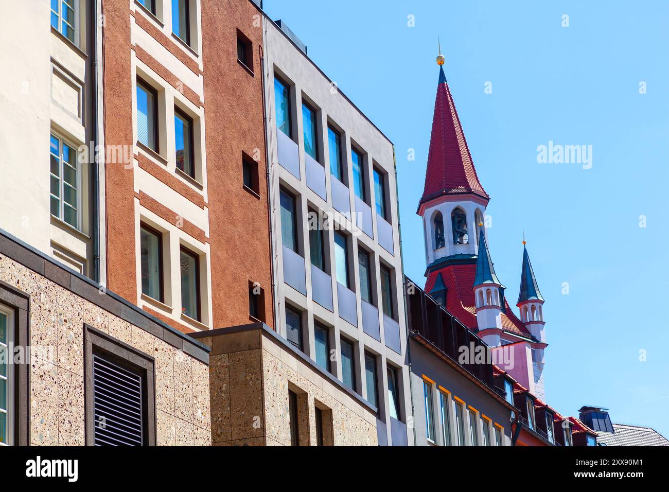 Clock tower prominently displayed atop a historic buildings in Munich ...