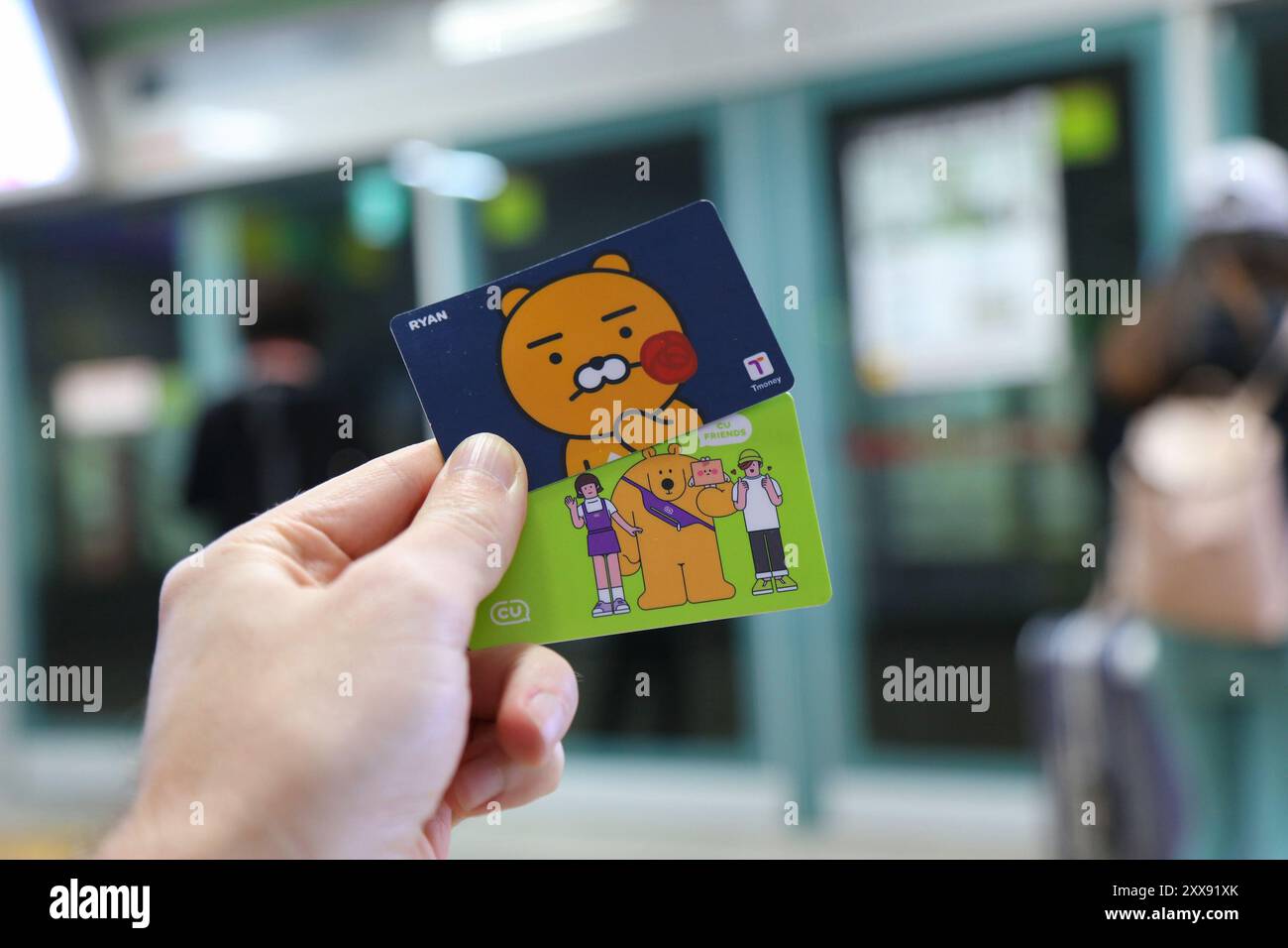 BUSAN, SOUTH KOREA - MARCH 30, 2023: Passenger holds two transportation ...