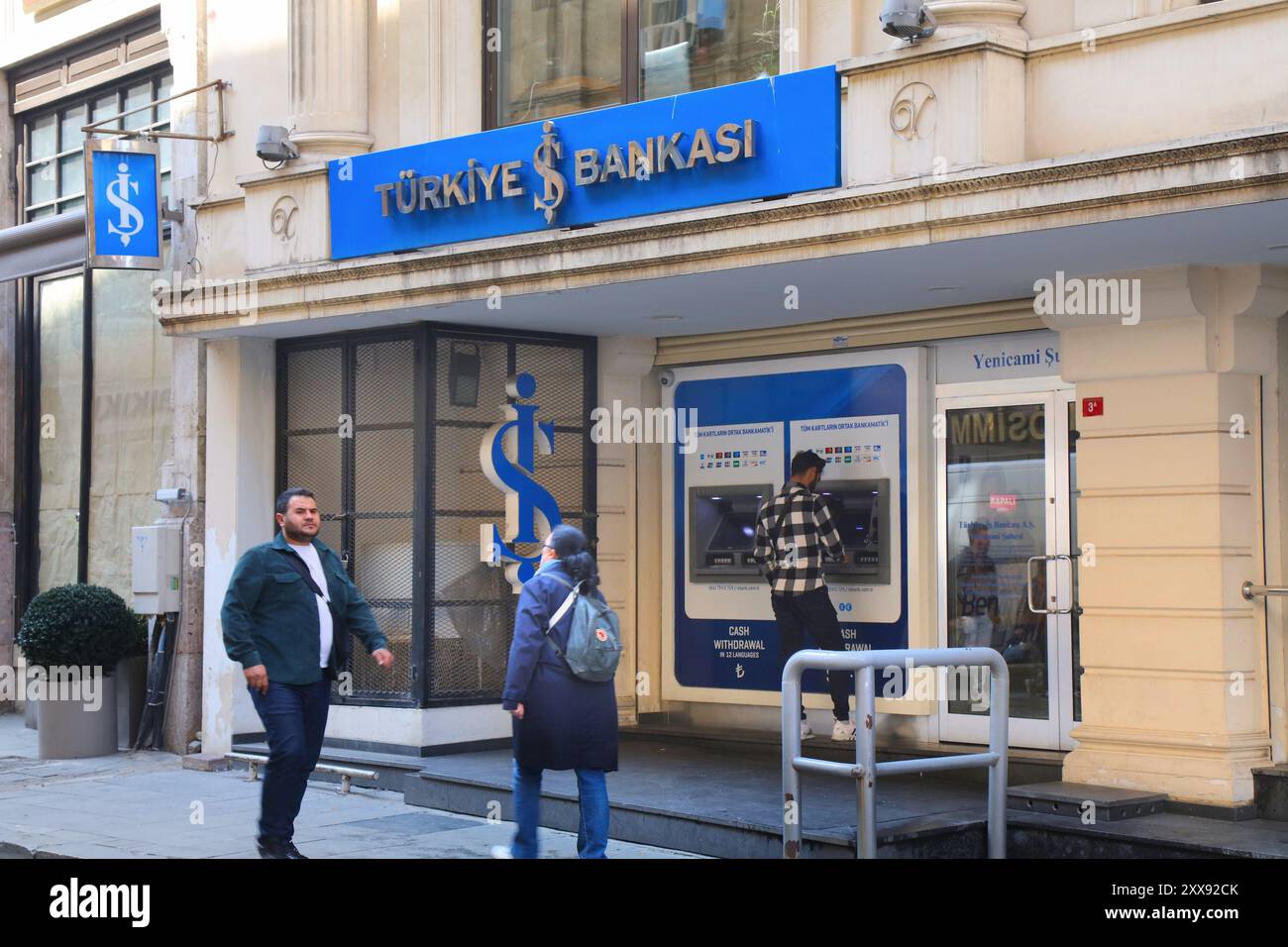 ISTANBUL, TURKEY - MARCH 25, 2023: Person visits Turkiye Bankasi branch ...