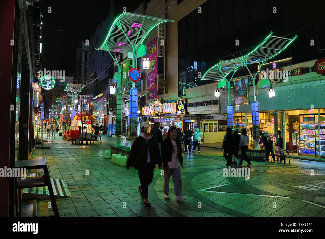 BUSAN, SOUTH KOREA - MARCH 28, 2023: People visit BIFF Square by night ...
