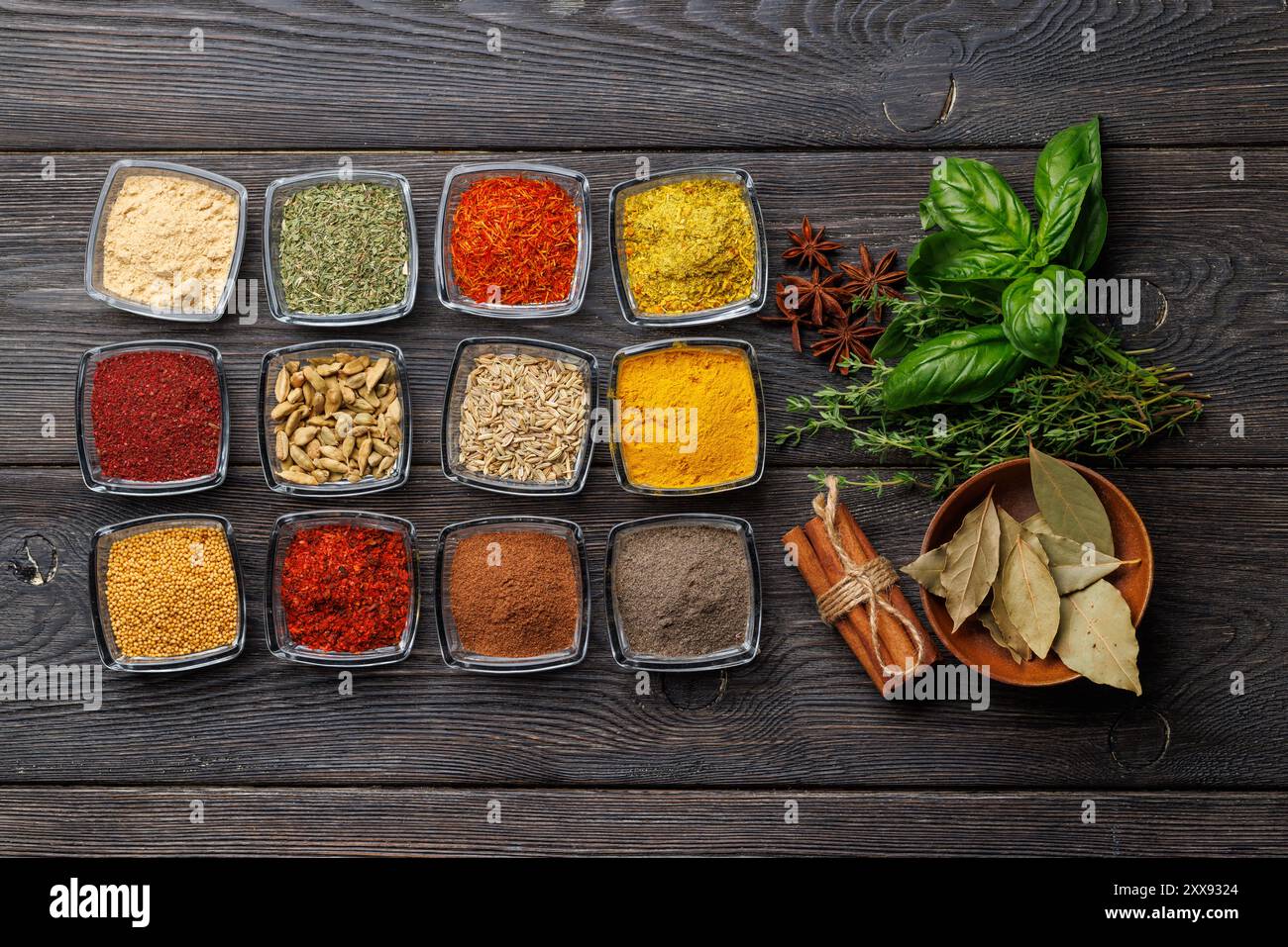 A vibrant assortment of various spices and herbs displayed together ...