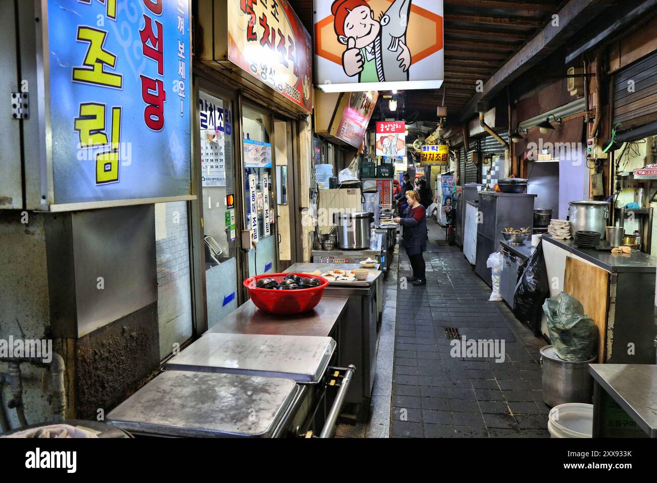 SEOUL, SOUTH KOREA - APRIL 6, 2023: Vendors prepare Korean food at ...