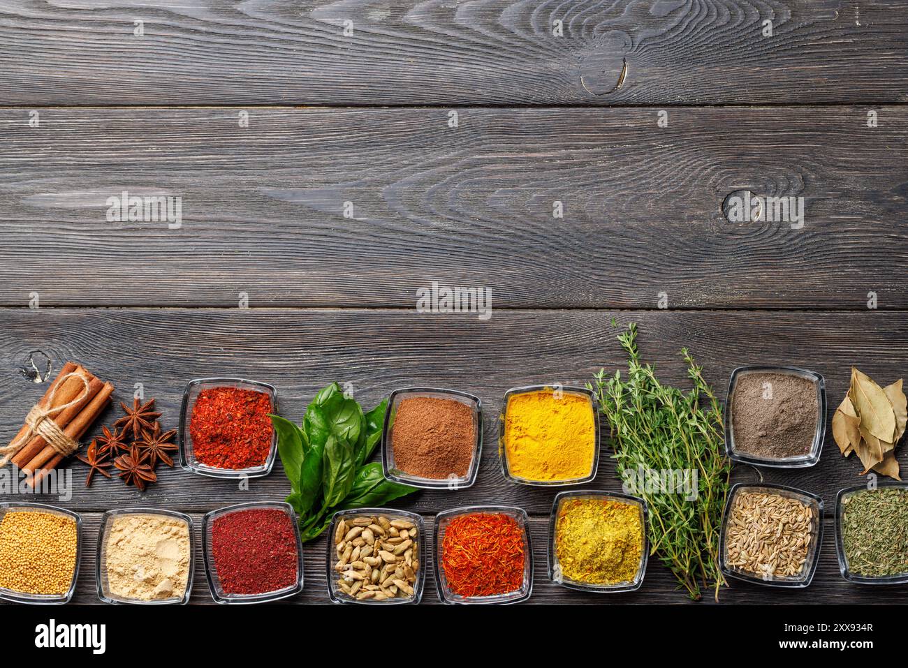 A vibrant assortment of various spices and herbs displayed together ...
