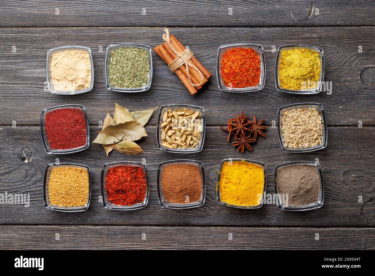 A vibrant assortment of various spices and herbs displayed together ...