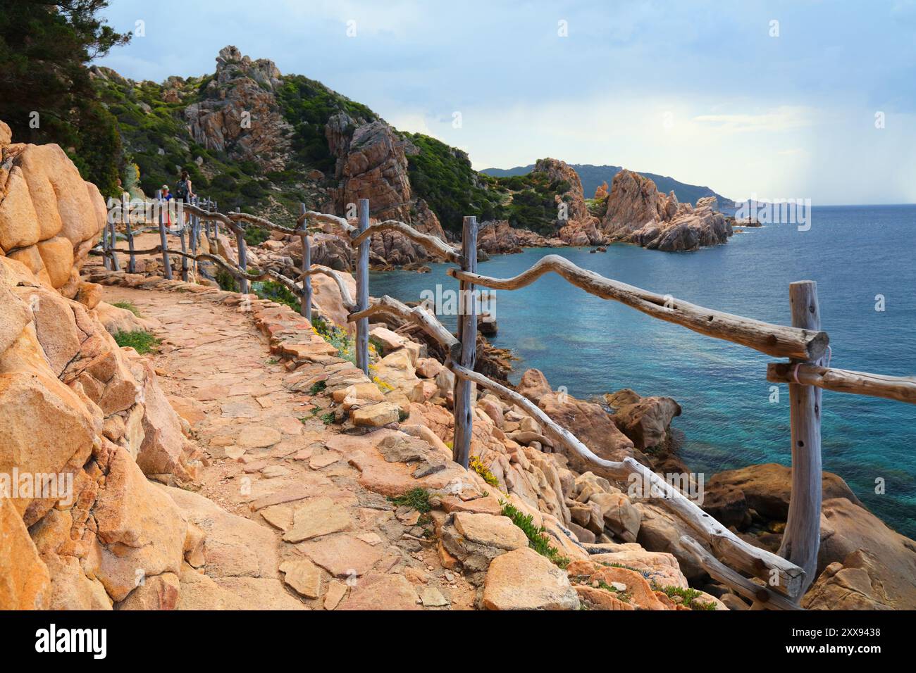 Trail leading to Li Cossi beach in Costa Paradiso in Sardinia island ...