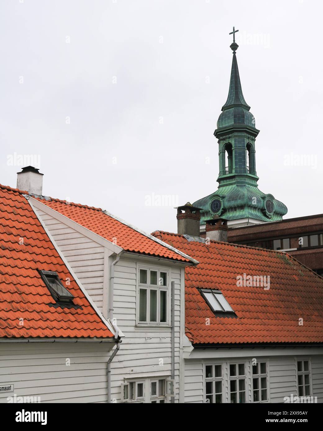 Tower of the Nykirken and tiled roofs in Bergen, Norway Stock Photo - Alamy