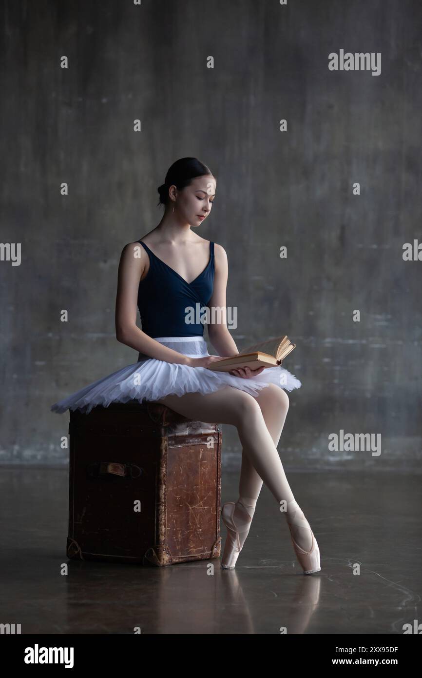 Portrait of a ballerina with a book Stock Photo - Alamy