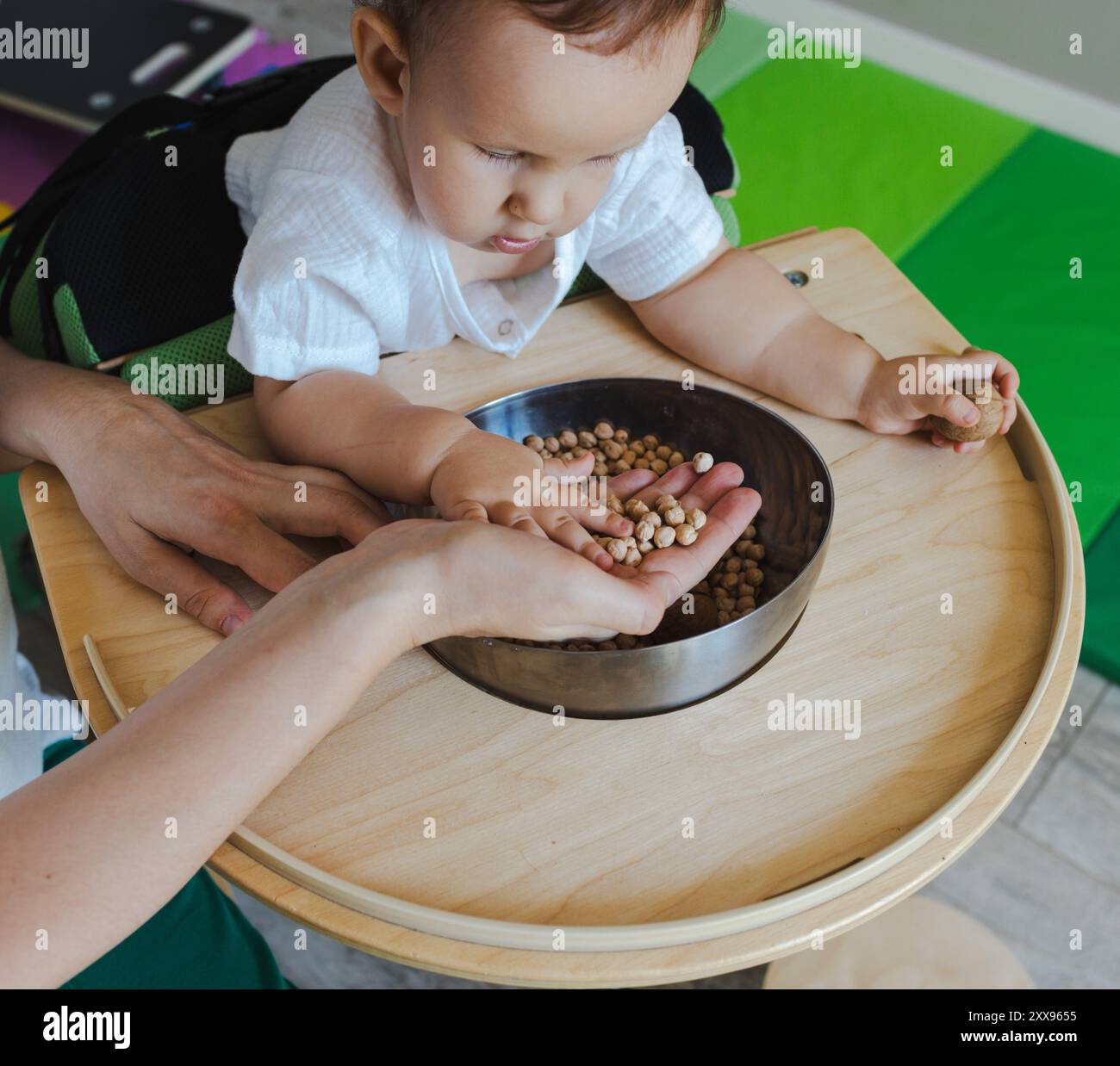 Little child patient engages in a therapeutic fine motor skills ...