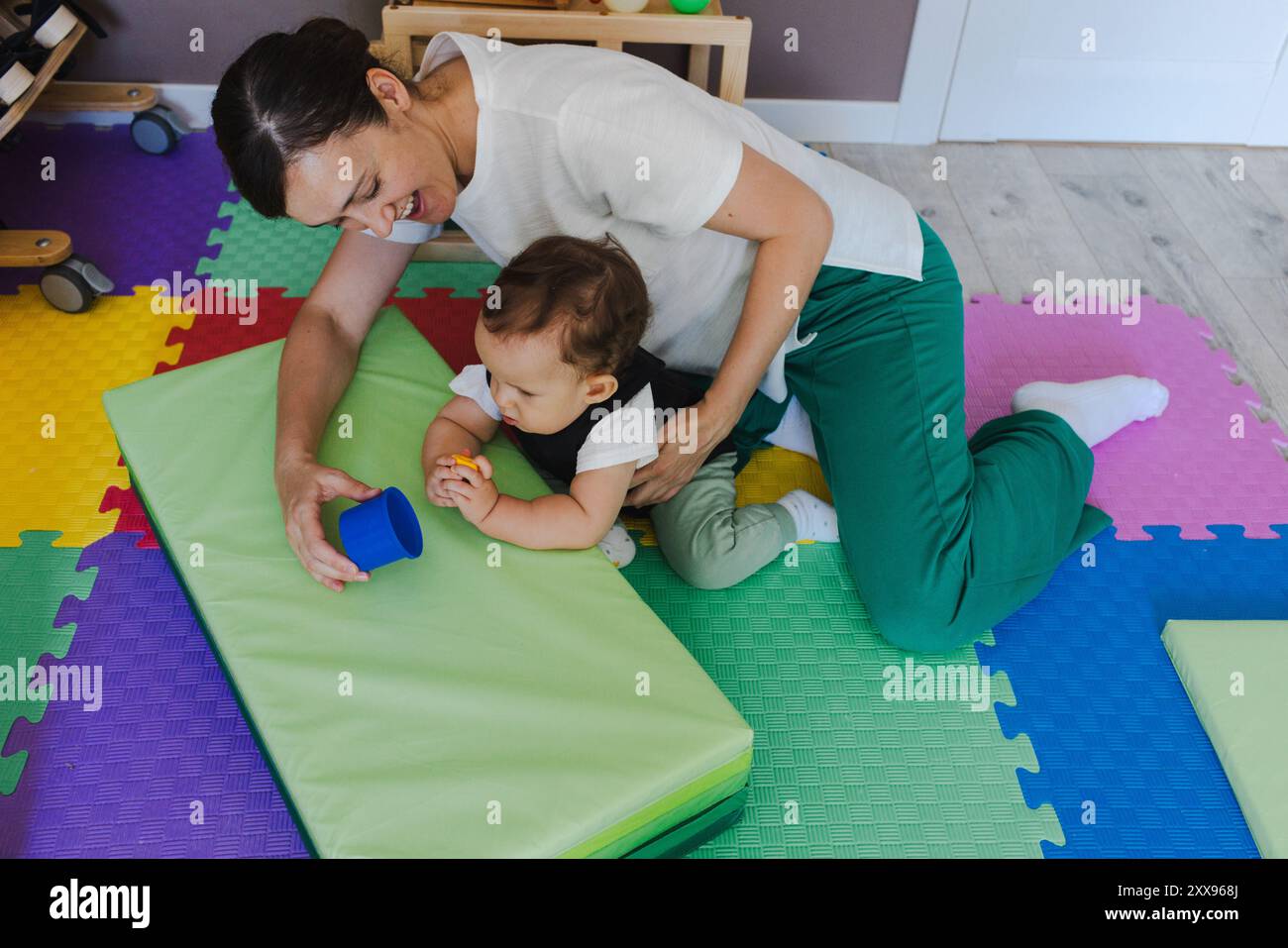 Little boy with musculoskeletal disorders in rehab corset engages in a ...