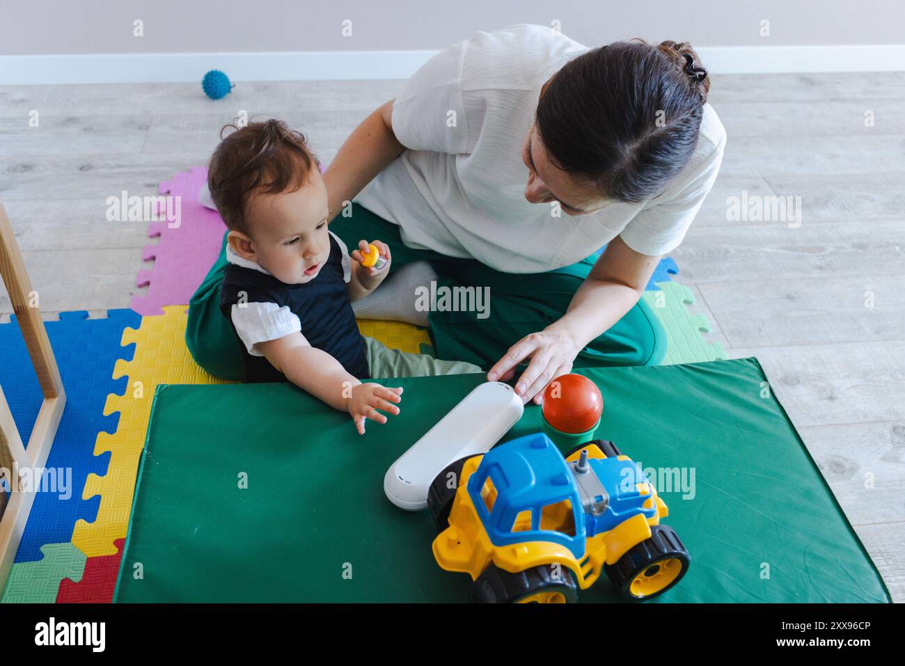 Cute little boy with neurodevelopmental disorders engages in therapy ...