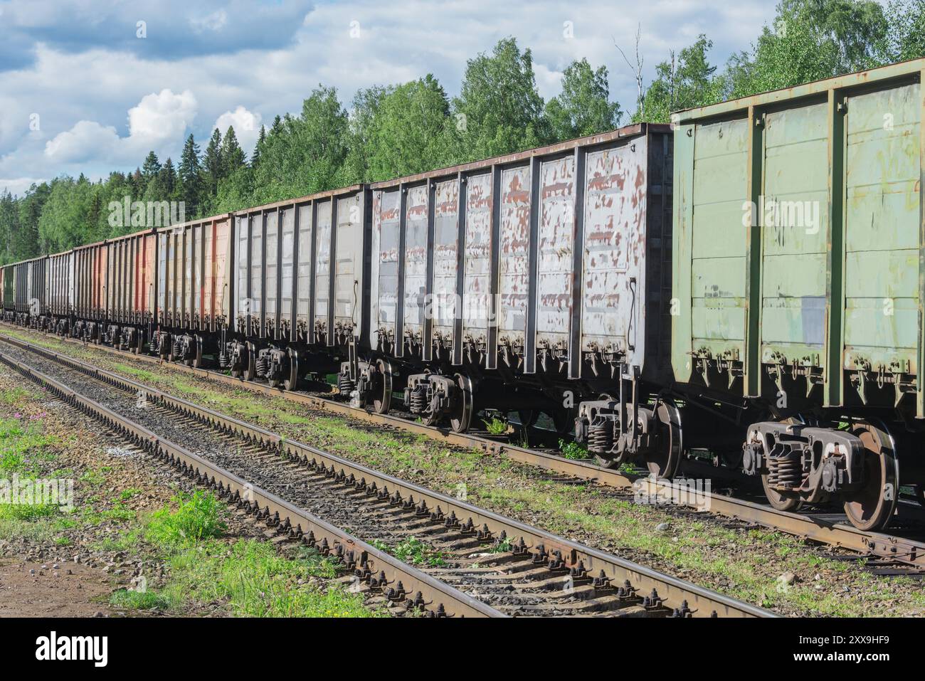 Long freight train standing on the station Stock Photo - Alamy