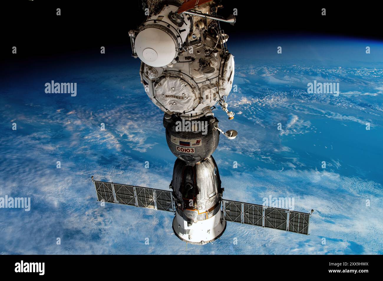 Soyuz spacecraft docked to the ISS with Planet Earth during the day ...