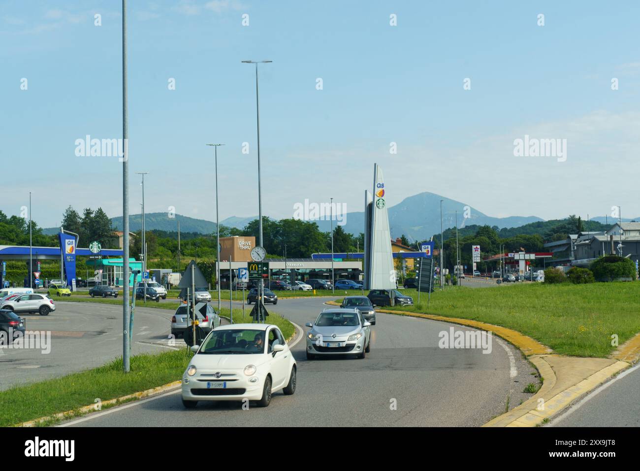 Cars driving through roundabout surrounded hi-res stock photography and ...