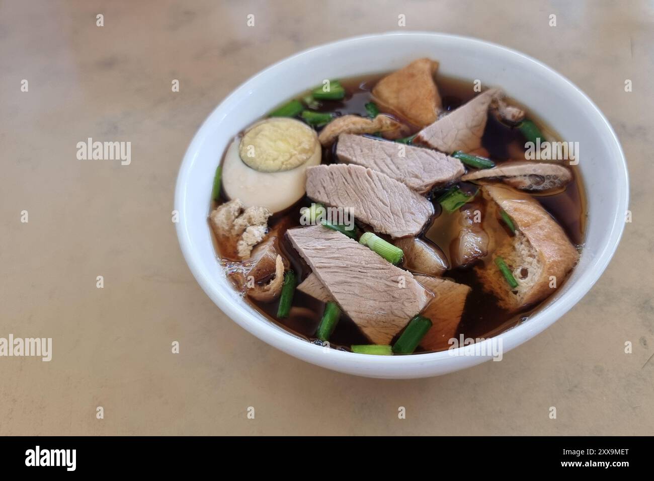 Bowl of kueh chap soup which is braised pork meat and organs, popular ...
