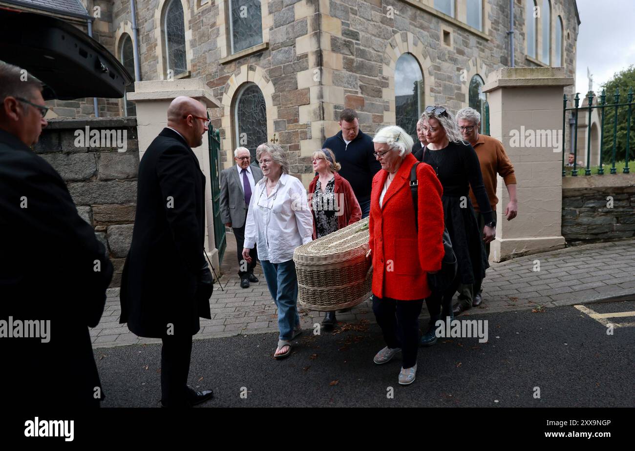 The coffin carrying Nell McCafferty is carried from St. Columba's ...