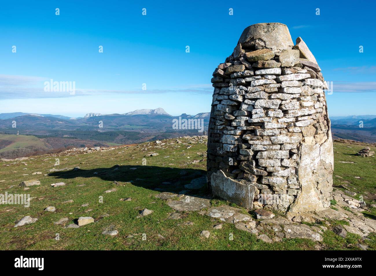 At the summit of Oketa Mountain, ancient stone markers stand sentinel ...