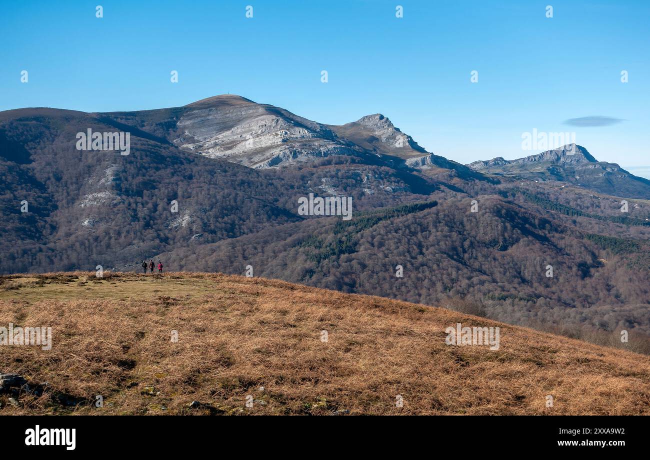 Hikers at the top of Oketa Mountain, soaking in the stunning panoramic views of autumn foliage ...